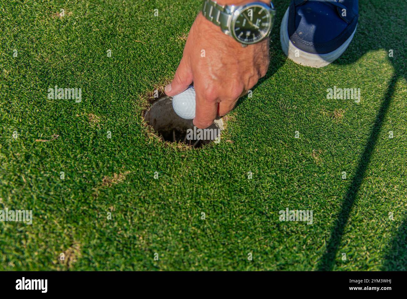 Retrieving golf ball from hole hi-res stock photography and images - Alamy
