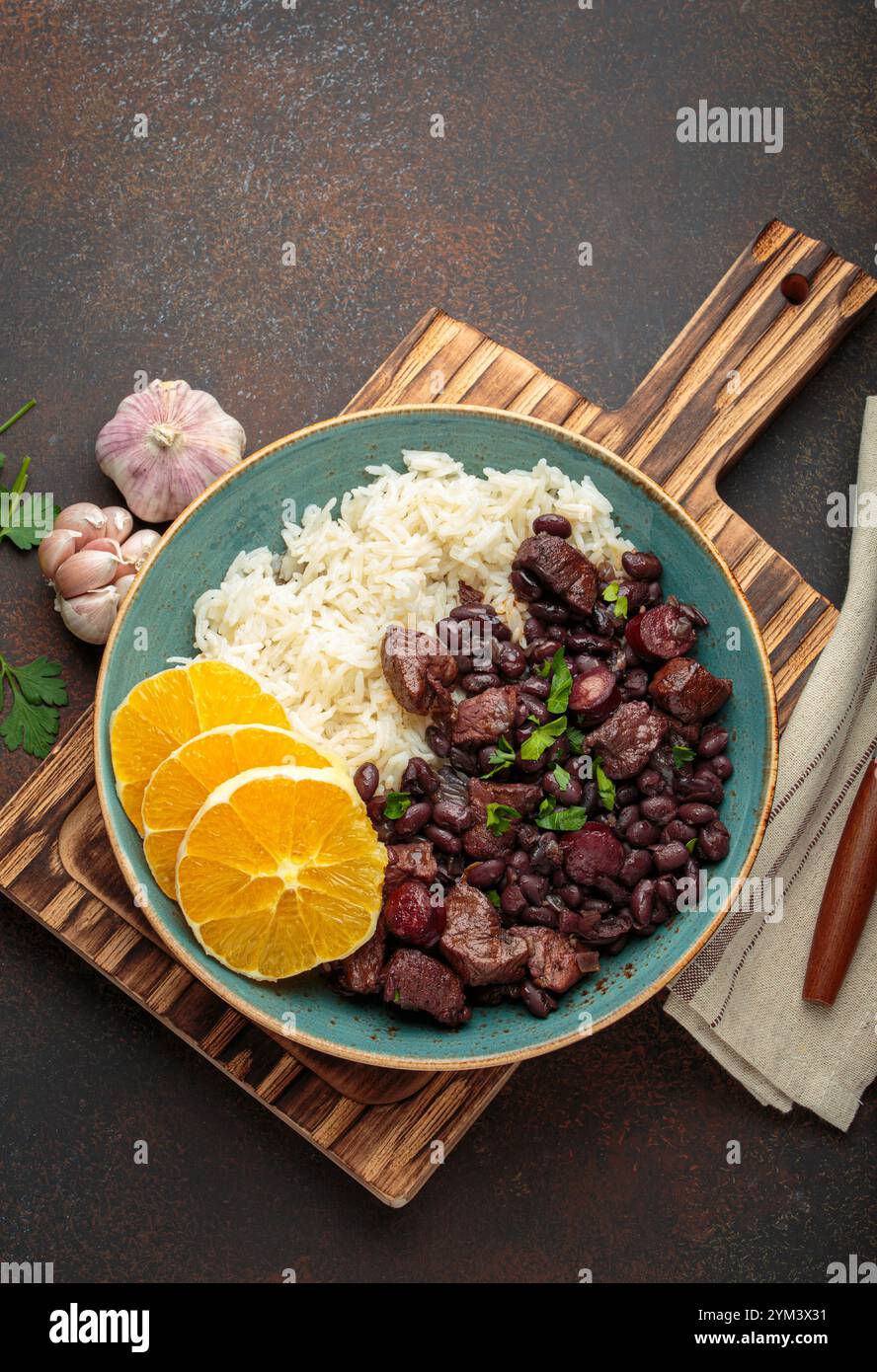 Feijoada, traditional brazilian stew with black beans, rice, and orange ...