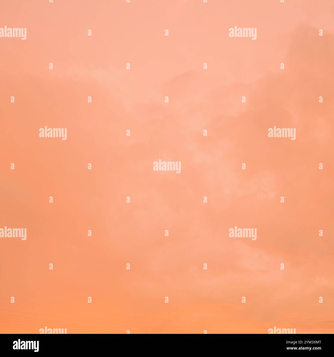 A bright and beautiful orange sky with clouds at dawn creates a ...