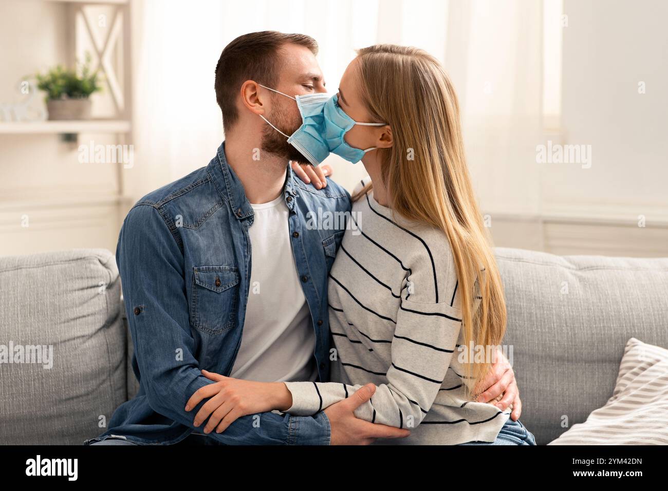 Married couple in medical masks hi-res stock photography and images - Alamy