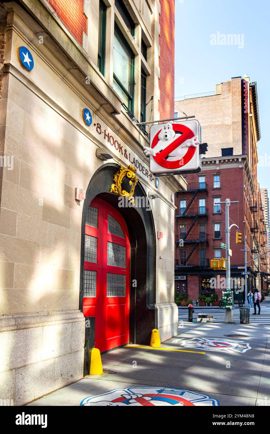 Historic fire station in an urban setting with bright red doors and ...
