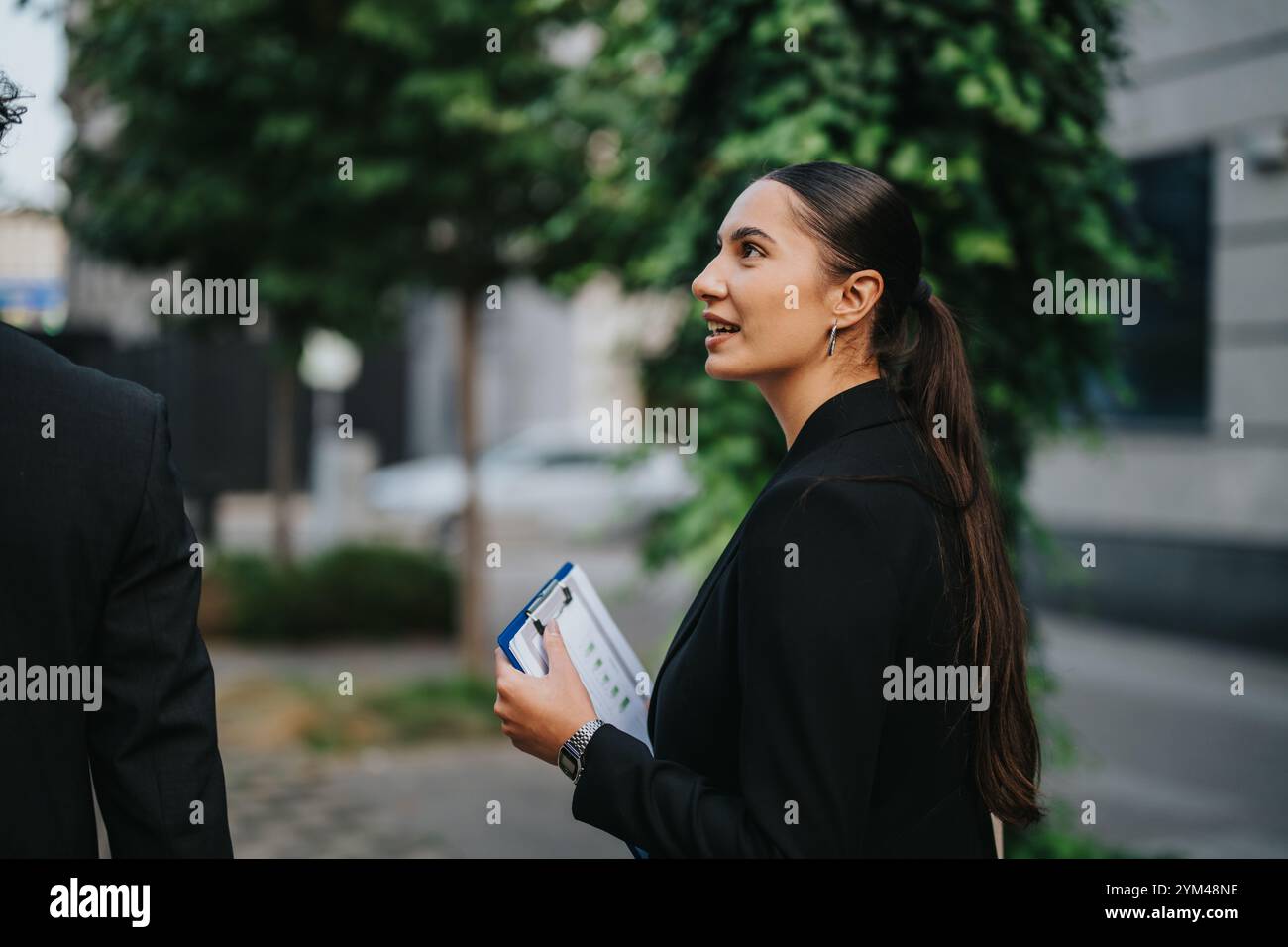 Business people brainstorming strategies in urban outdoor setting Stock ...