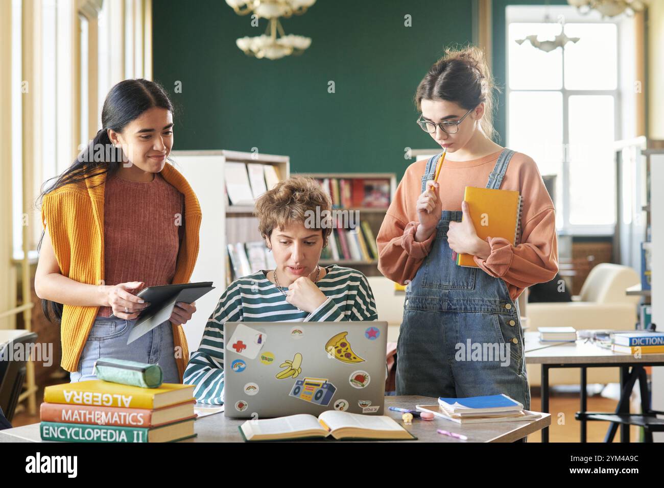 Collaborating in Study Group in Library Setting Stock Photo - Alamy