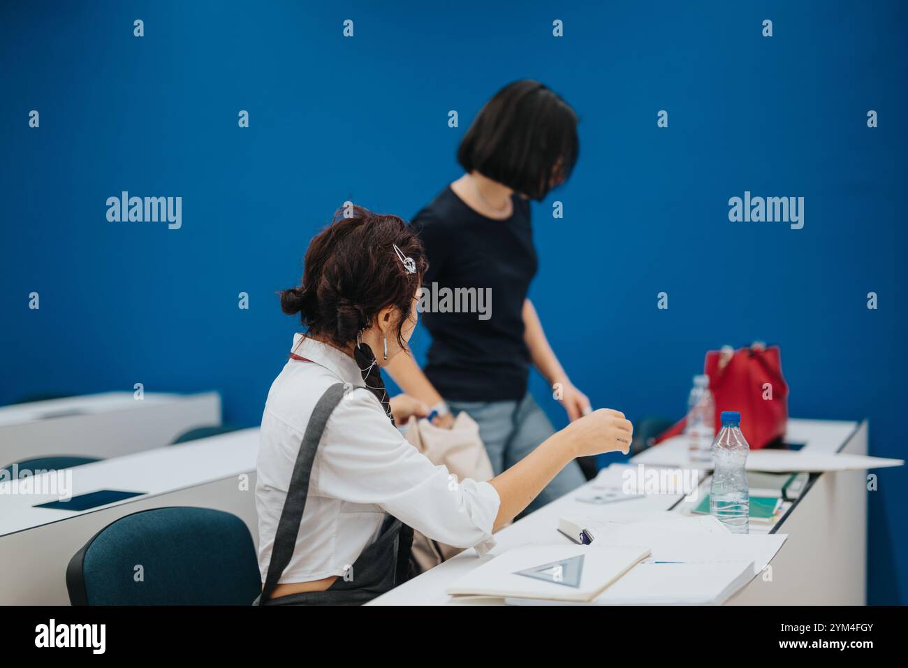 Students attending a class in a modern classroom setting Stock Photo ...