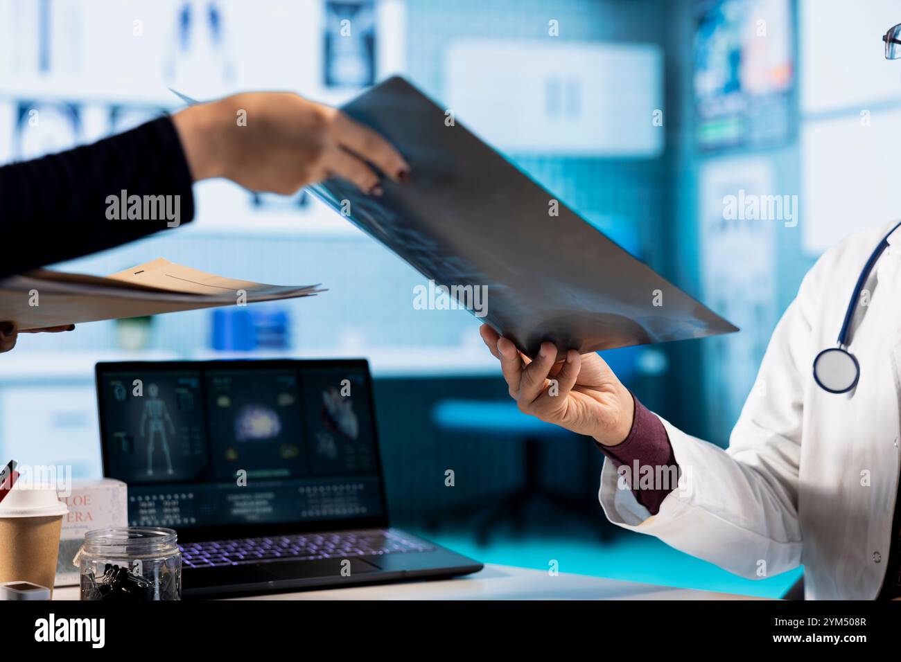 Healthcare provider presenting lab test results to a patient in office ...