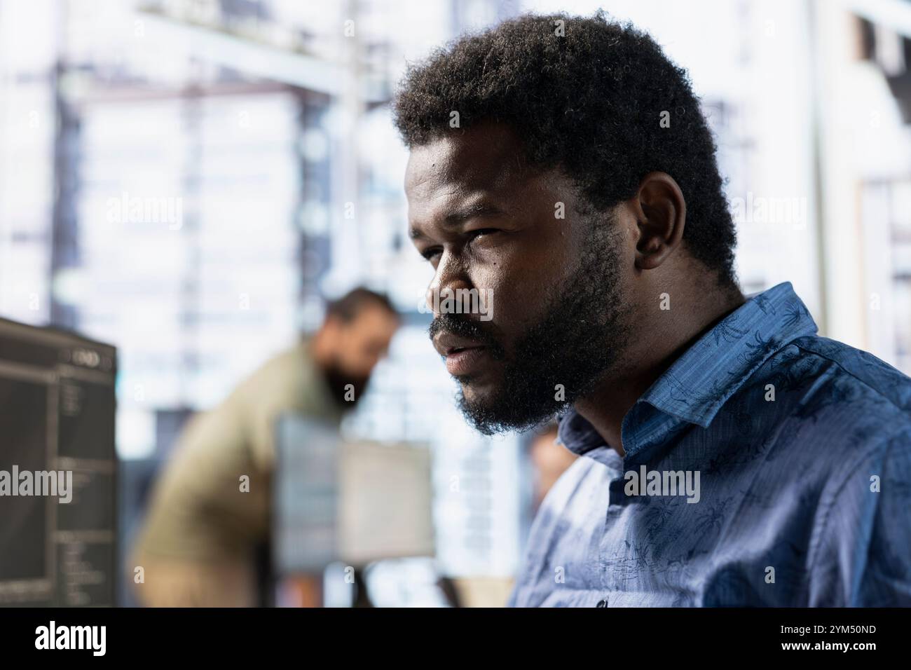 Software developer focused on debugging hi-res stock photography and images - Alamy