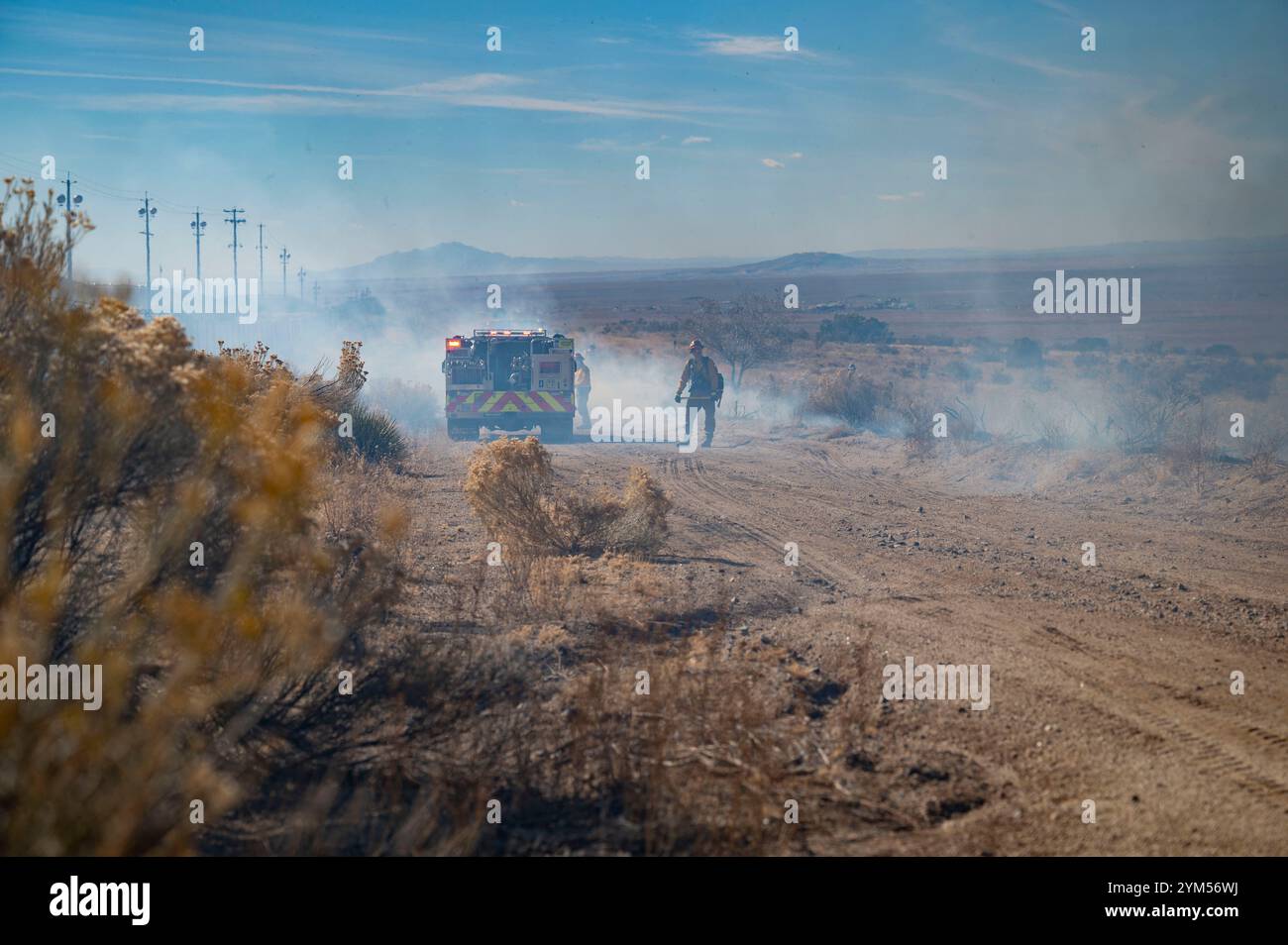 A Kirtland Air Force Base firefighter prepares for a prescribed burn at ...