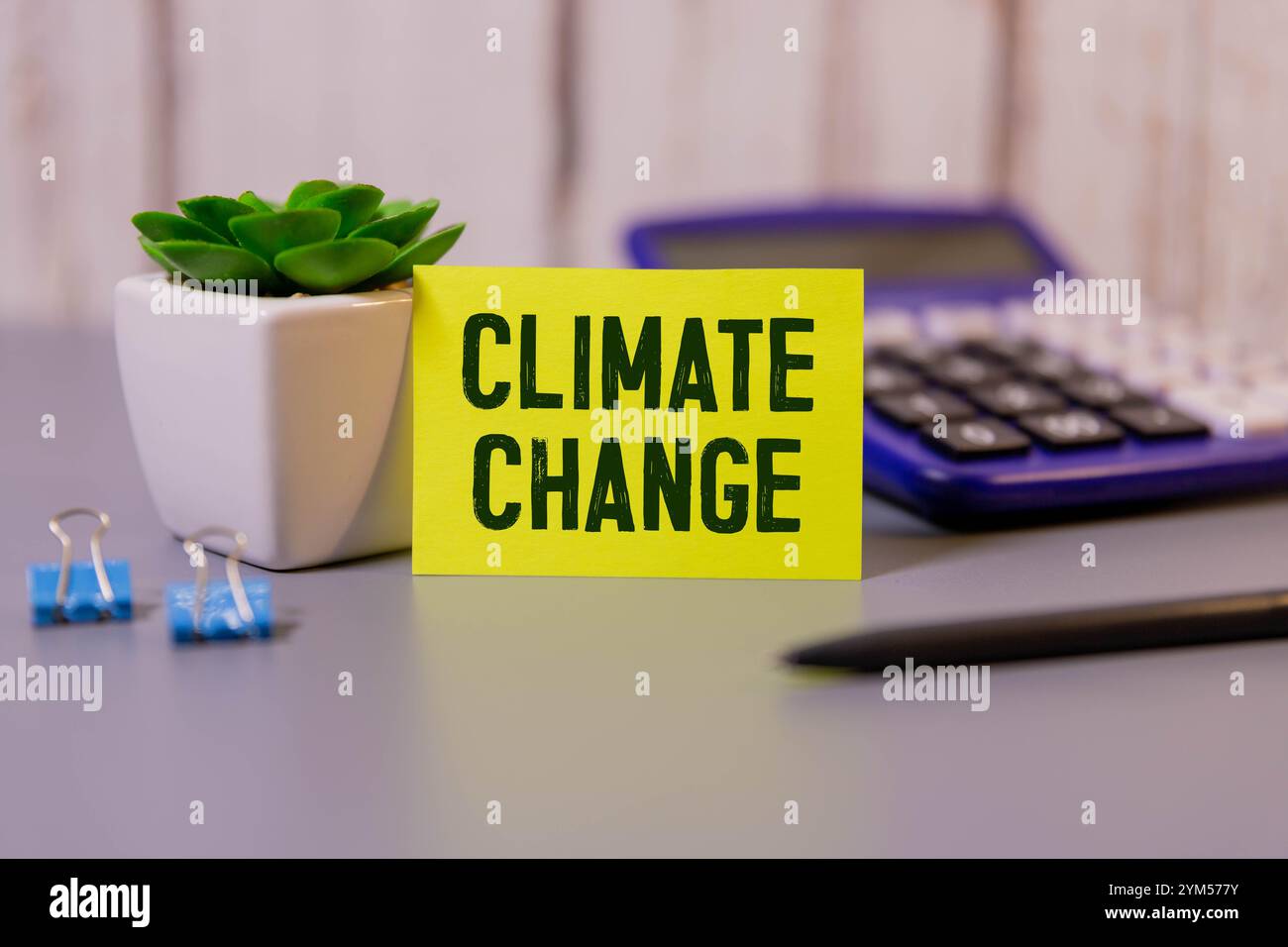 wooden block with CLIMATE CHANGE text on grass background ...
