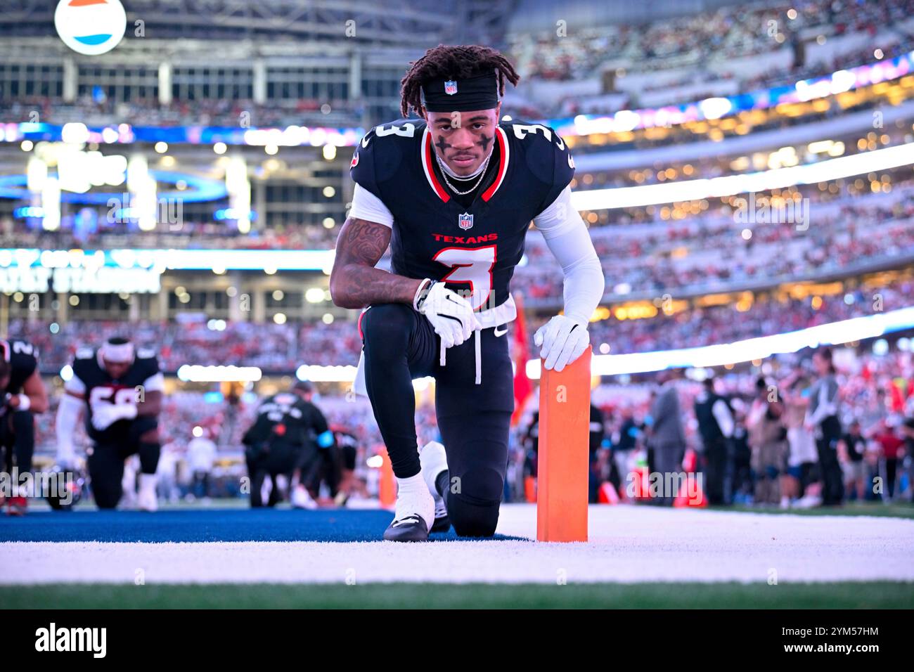 Houston Texans wide receiver Tank Dell (3) kneels on the field before ...