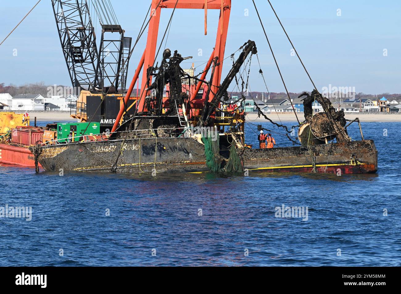 The 77-foot fishing vessel Susan Rose is raised from the sea during a ...