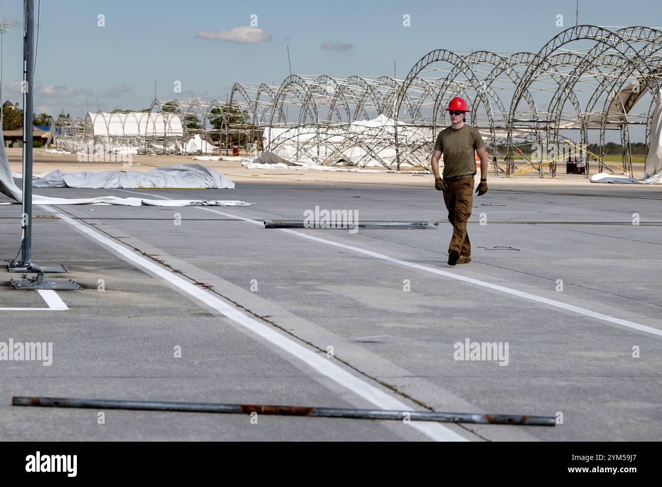 A U.S. Air Force Airman assigned to the 823rd RED HORSE Squadron ...