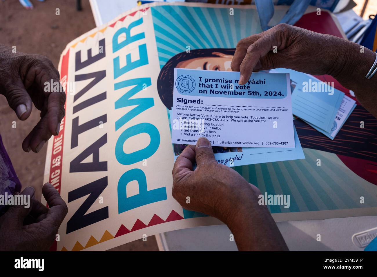 FILE - Local organizer Maria Calamity instructs a resident on how to ...