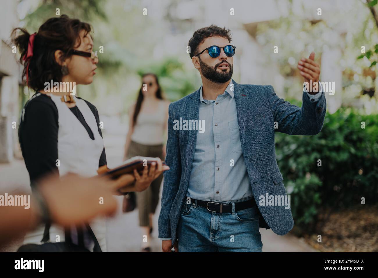 Diverse business team brainstorming in outdoor urban area Stock Photo ...