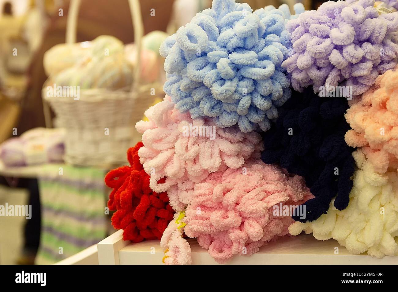 Colors wool balls on shop display stand for sale. Handicraft supplies ...