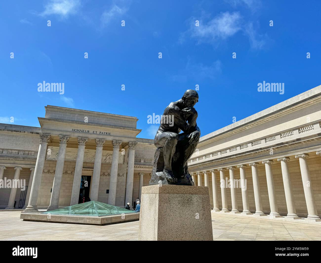 Exterior view of the columned, neo-classical building. The thinker by ...