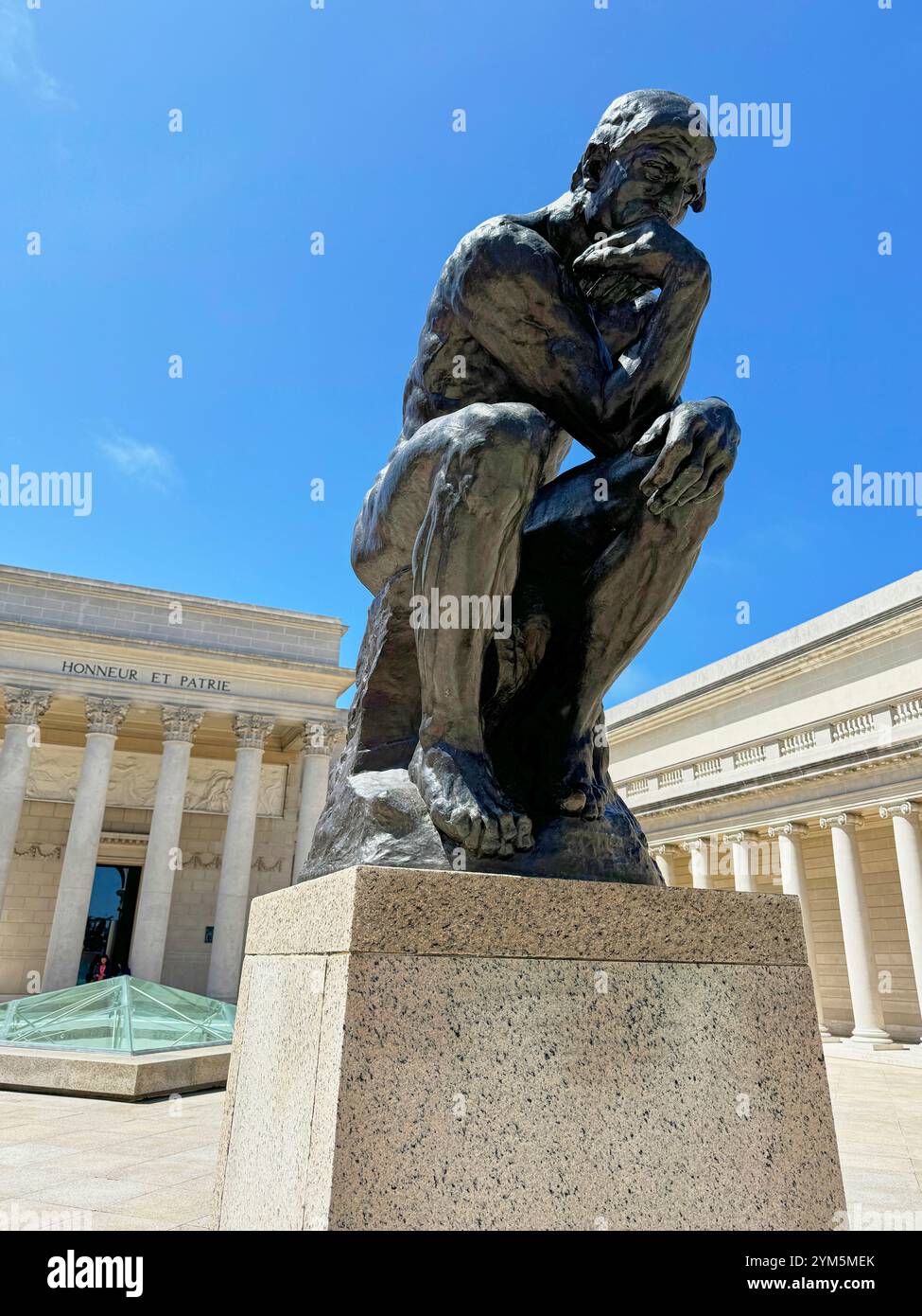 Exterior view of the columned, neo-classical building. The thinker by ...