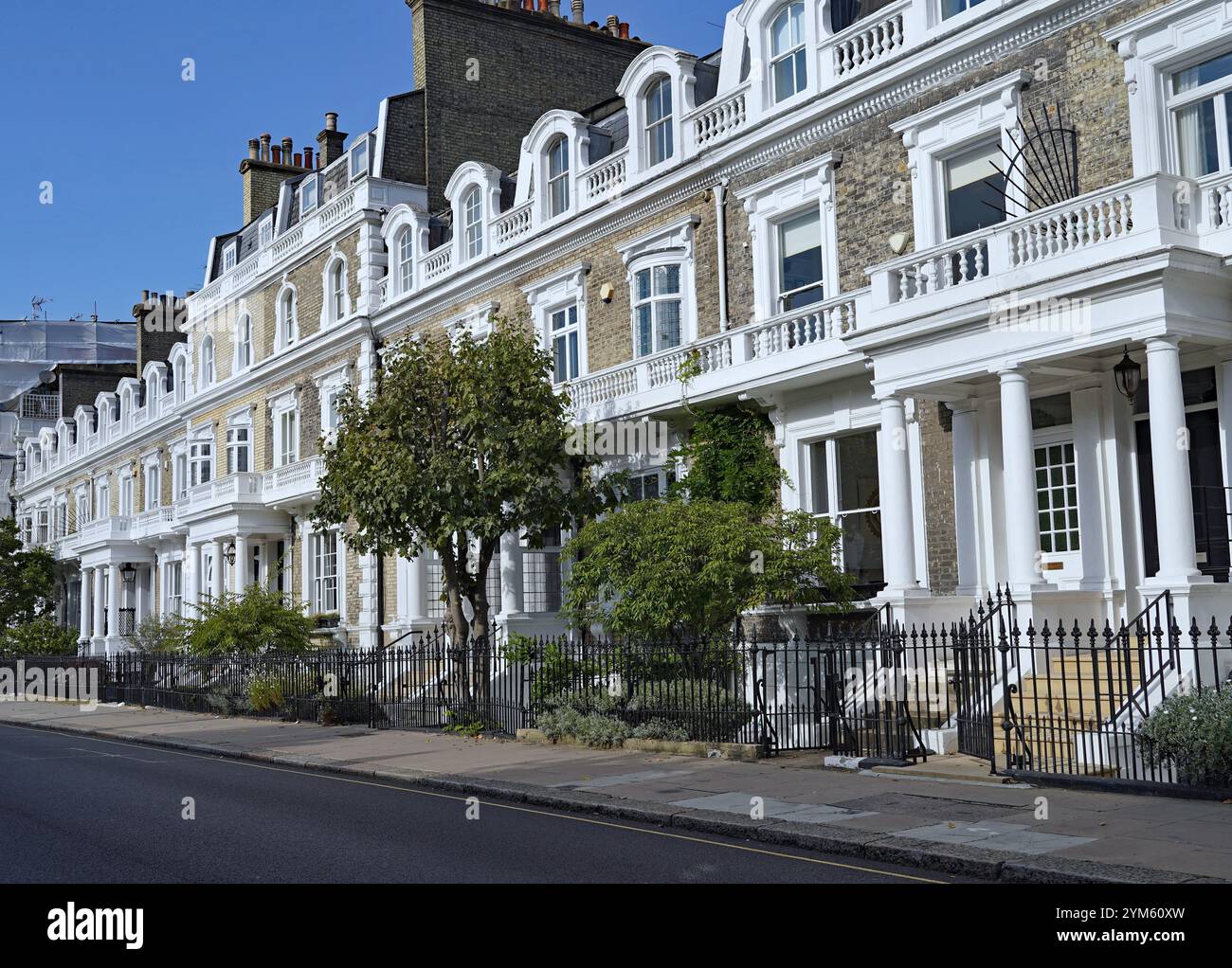 Row of townhouses with portico entrance and dormer windows in the ...