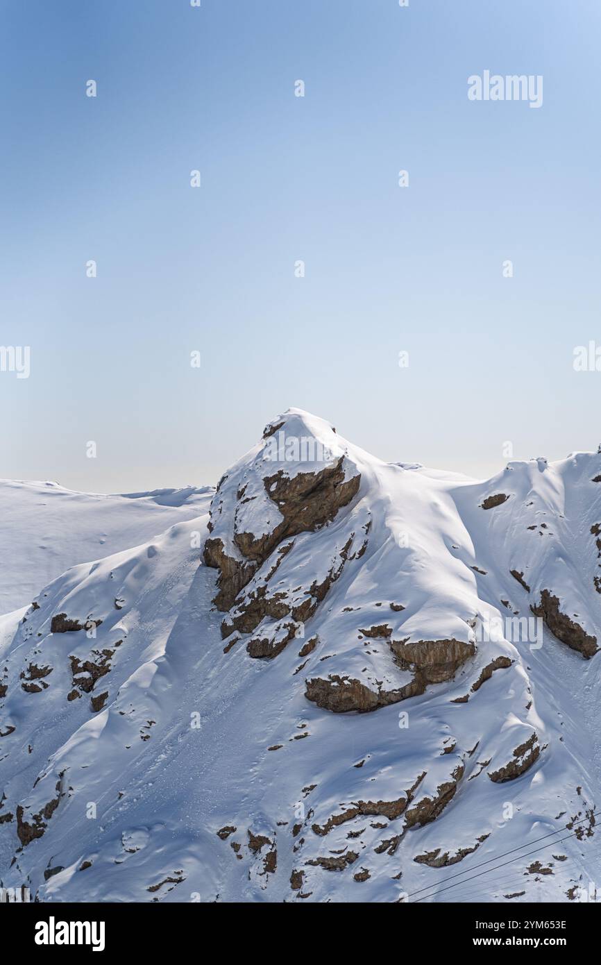 Snow-Covered Mountain Peaks Under a Clear Blue Sky Stock Photo - Alamy