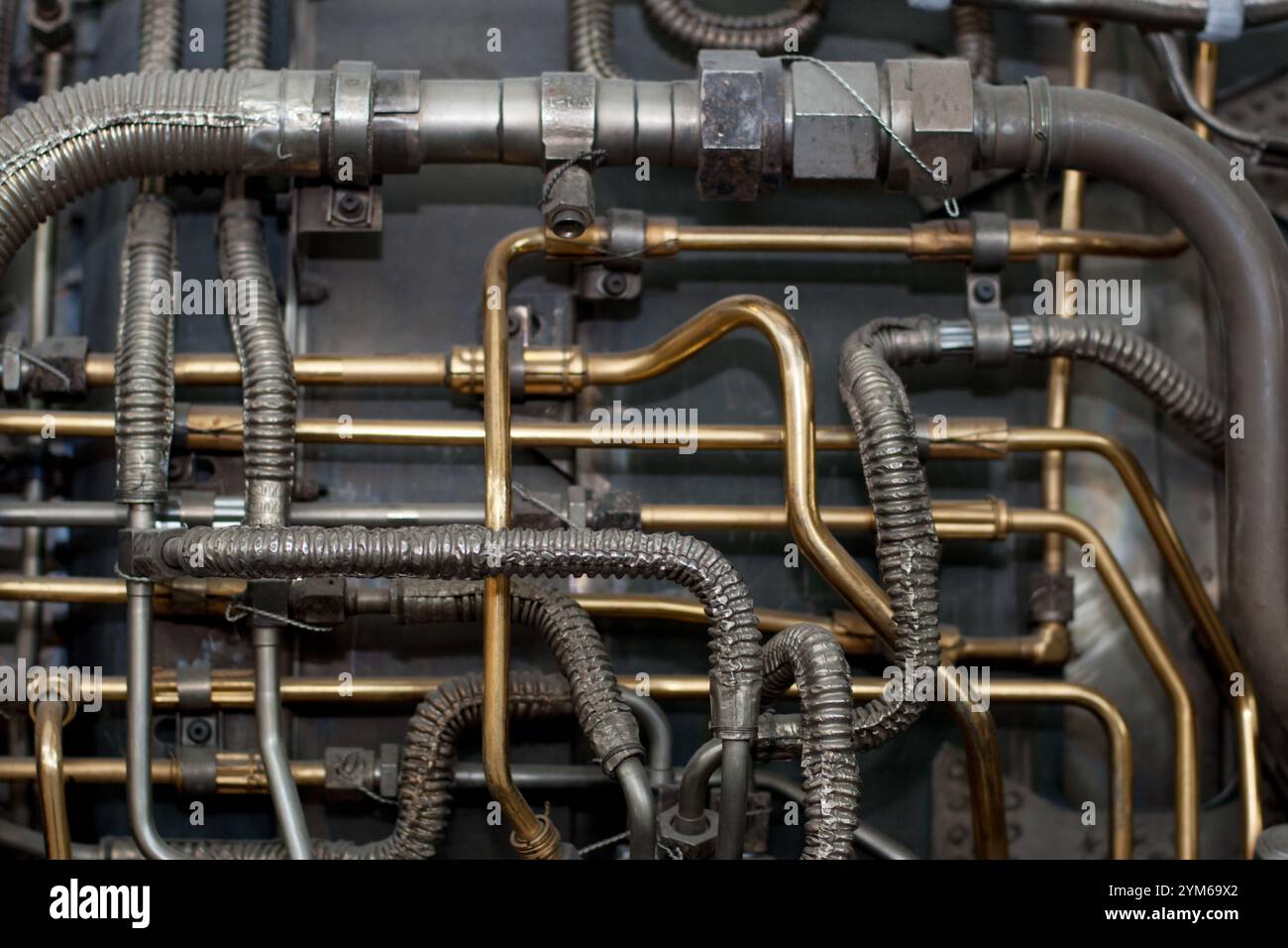 Industrial techno background of various pipes and wires on the aircraft ...