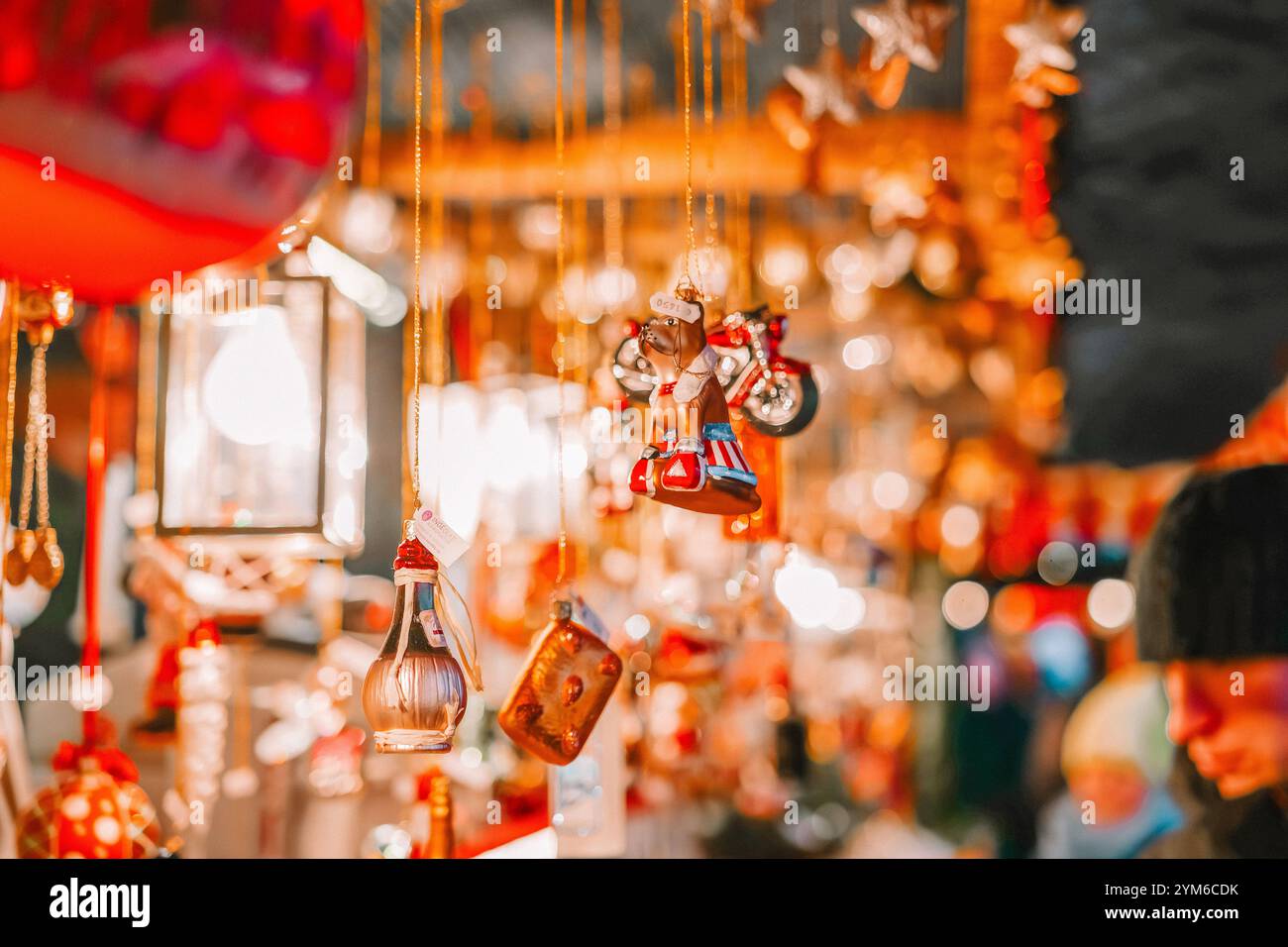 Christmas toys, balls and decorations on blurred Christmas market ...