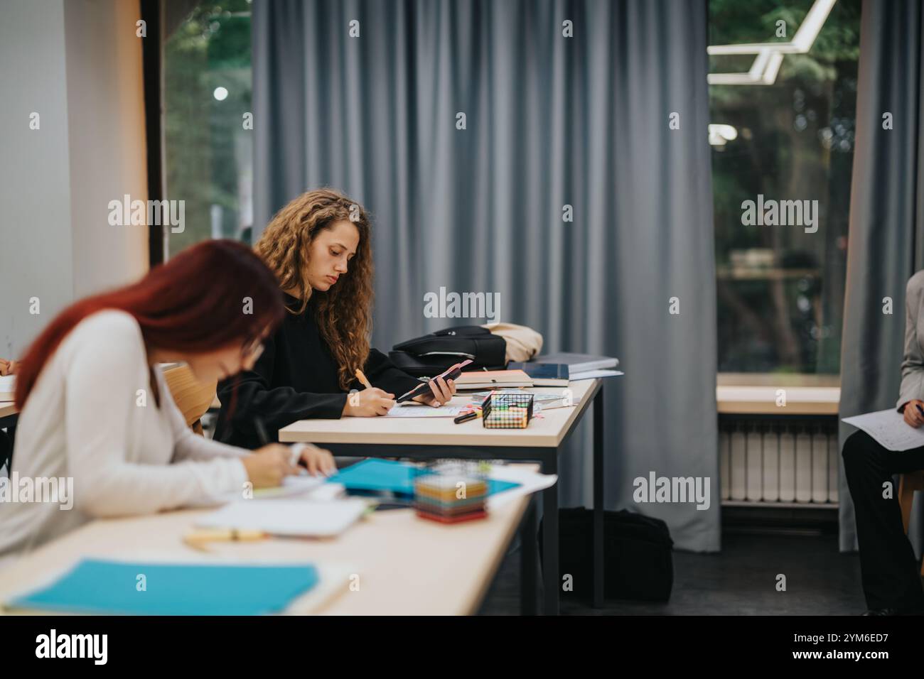 Students concentrating in a modern classroom environment Stock Photo ...