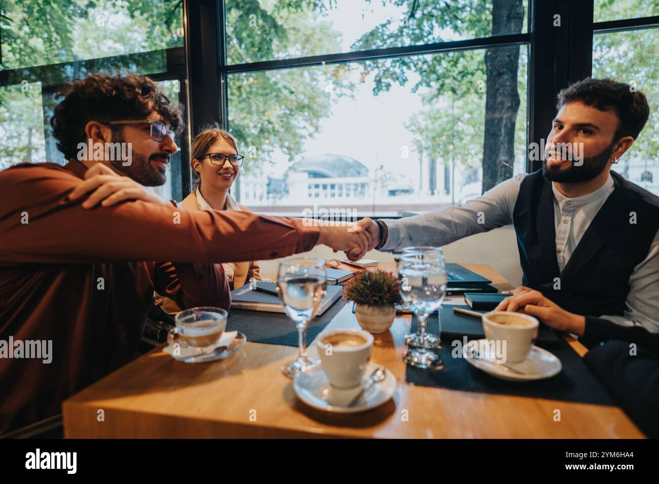 Business people ending a successful meeting with a handshake Stock ...