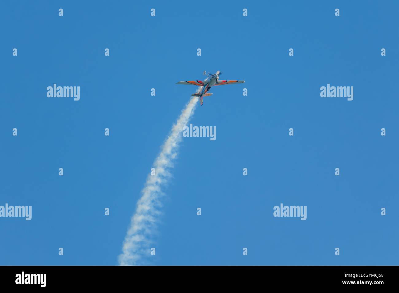 Stunt aerobatic plane performing stunts in air Stock Photo - Alamy