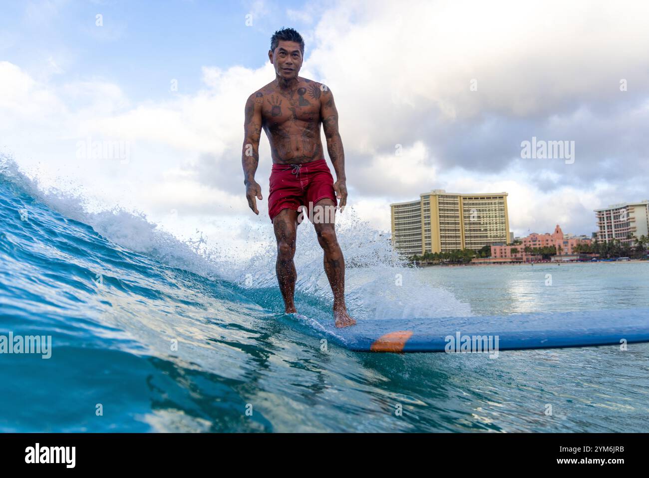 Handsome man standing surfing board hi-res stock photography and images - Alamy