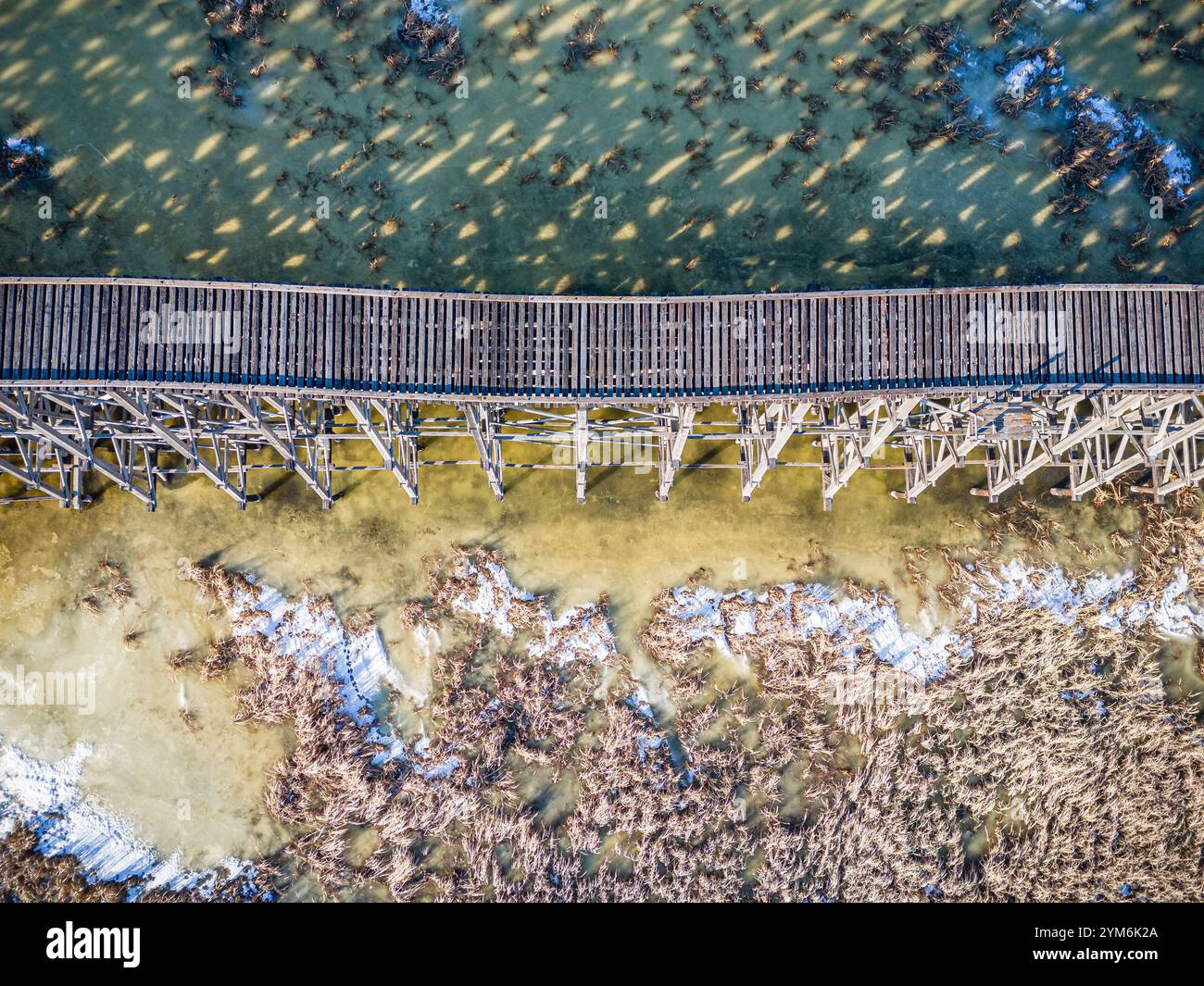 A bridge over a body of water with a lot of debris floating in the ...