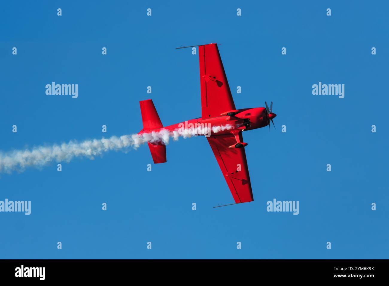 Stunt aerobatic plane performing stunts in air Stock Photo - Alamy