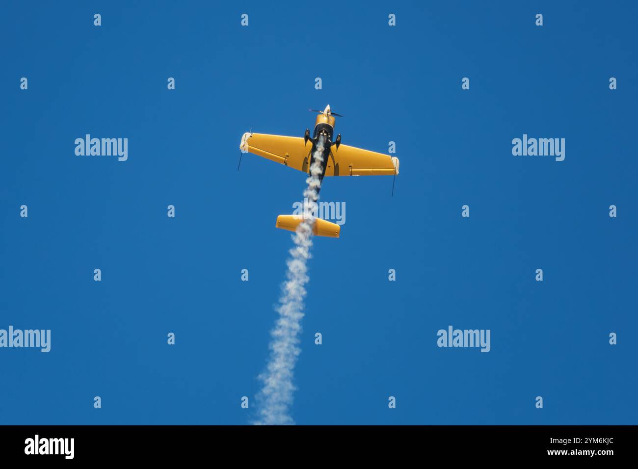 Stunt aerobatic plane performing stunts in air Stock Photo - Alamy