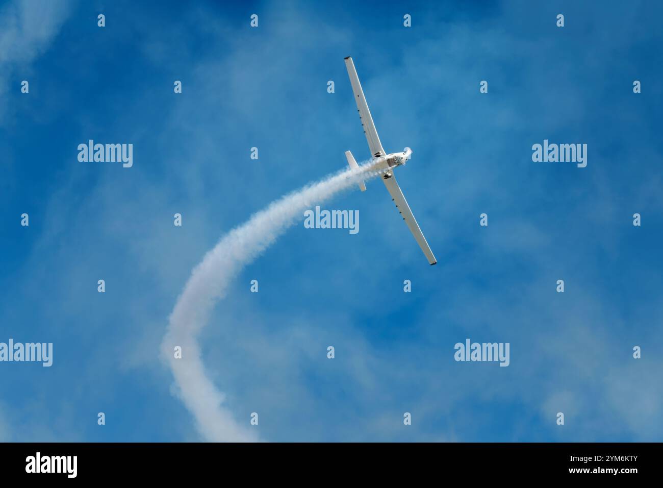 Stunt aerobatic plane performing stunts in air Stock Photo - Alamy