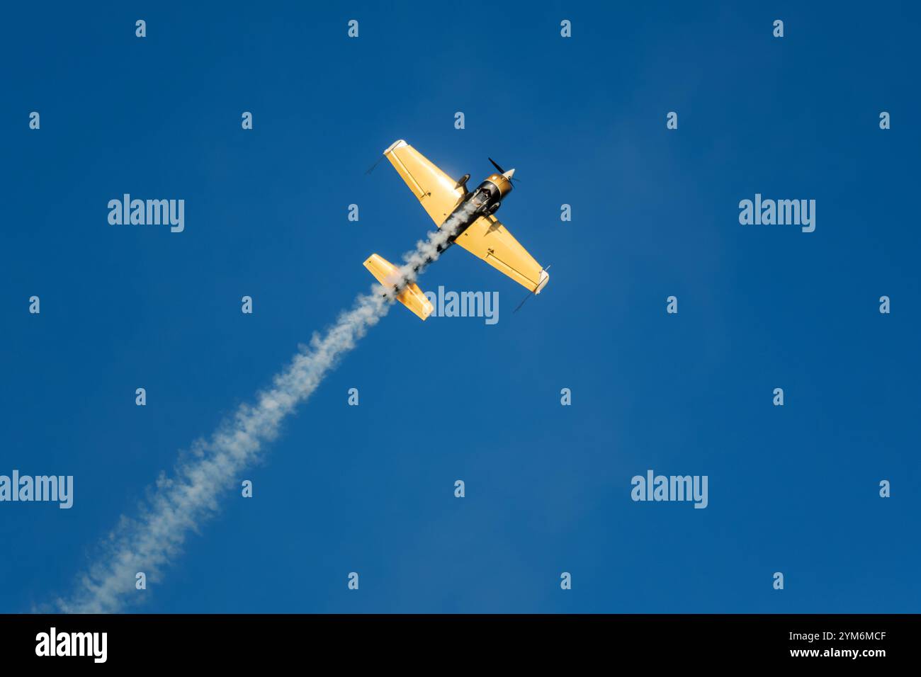 Stunt aerobatic plane performing stunts in air Stock Photo - Alamy