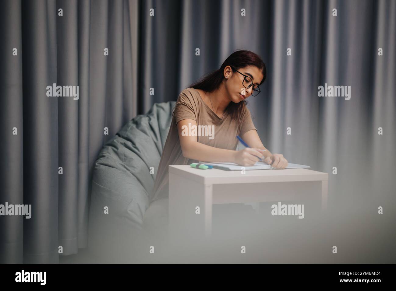 Focused high school student studying in a calm setting Stock Photo - Alamy