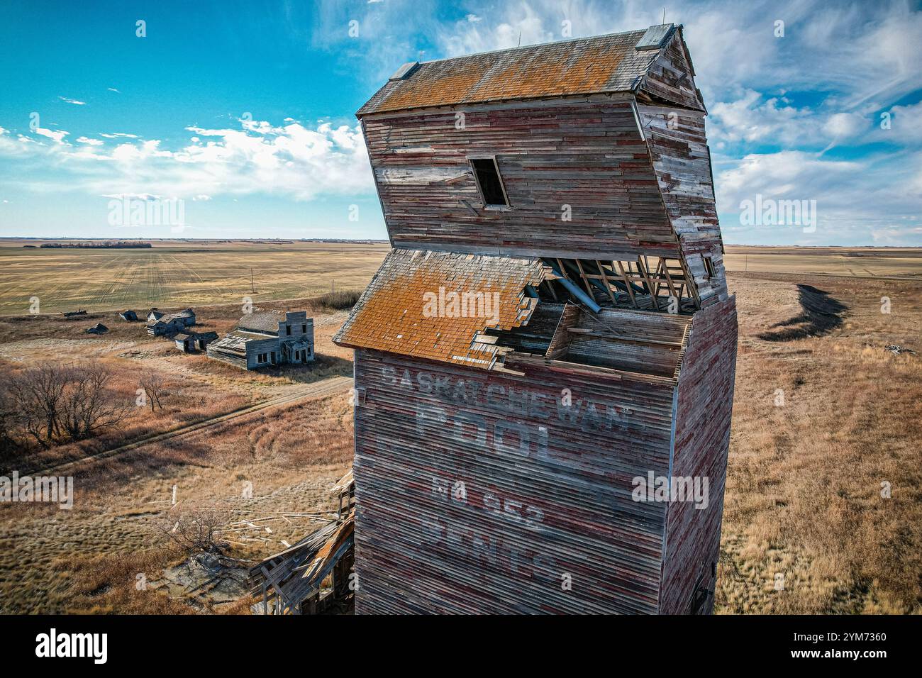 A large, old brick building with a slanted roof. The building is in a ...