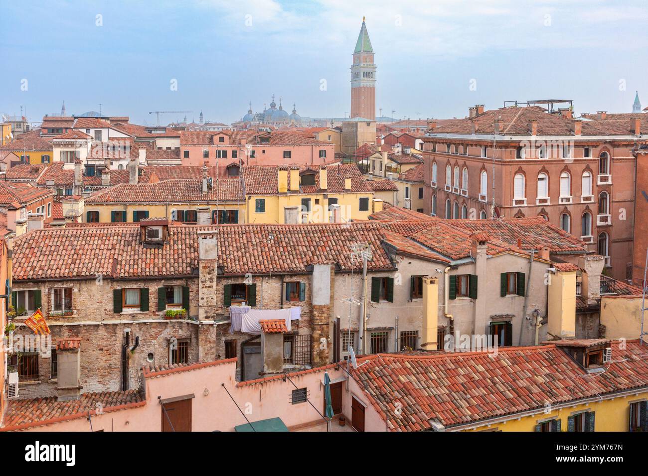 Aerial view of Venetian rooftops and medieval architecture with a bell ...
