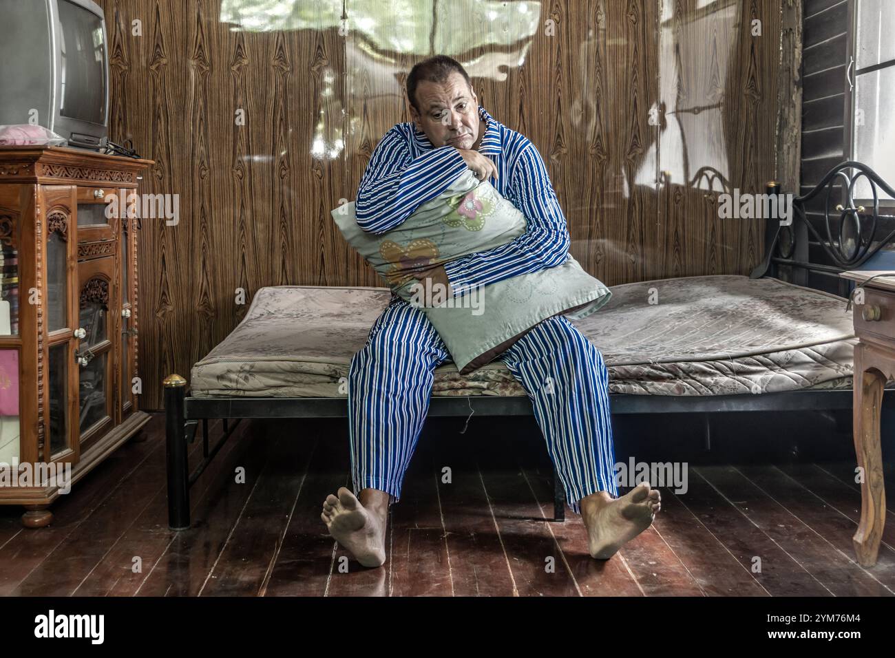 Man in pajamas hugs hi-res stock photography and images - Alamy