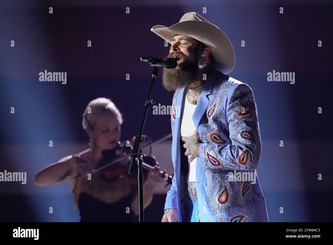 Post Malone performs during the 58th Annual CMA Awards on Wednesday ...