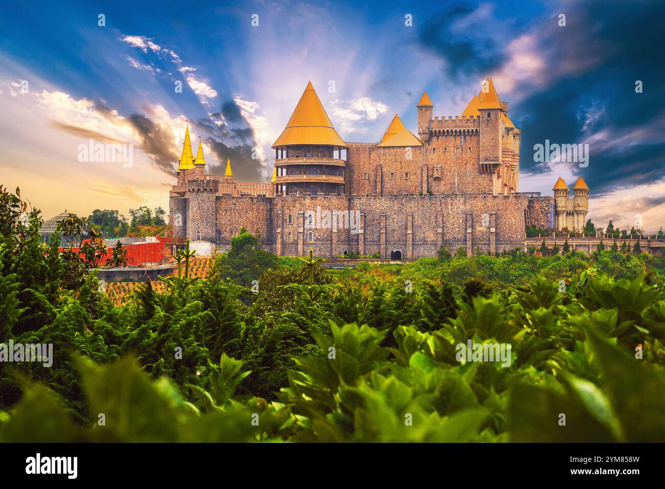 Fairy fabulous beautiful medieval castle at sunrise in Ba Na Hills Park ...