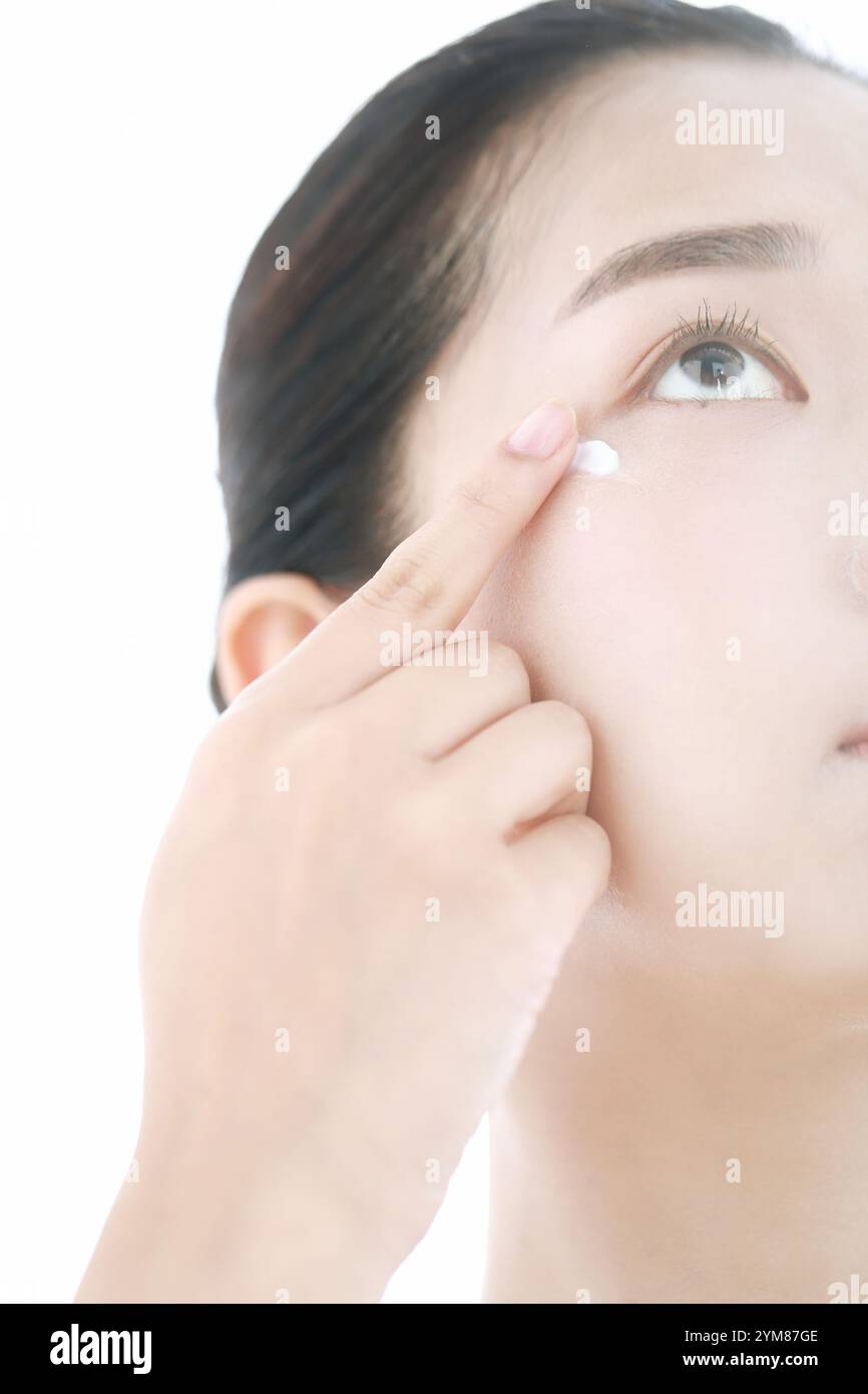 Woman cream applying face hi-res stock photography and images - Alamy