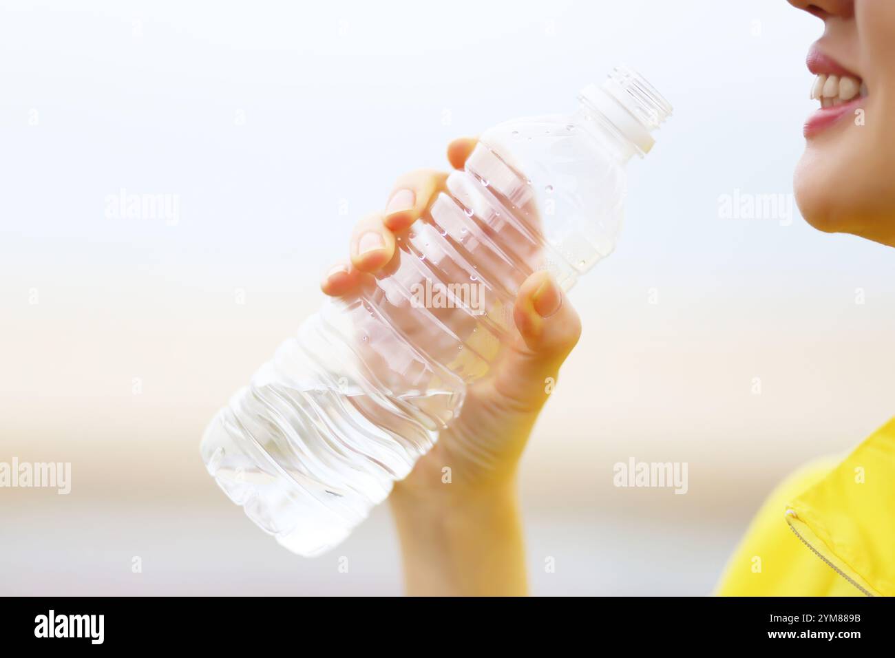 Drinking water after exercise hi-res stock photography and images - Alamy
