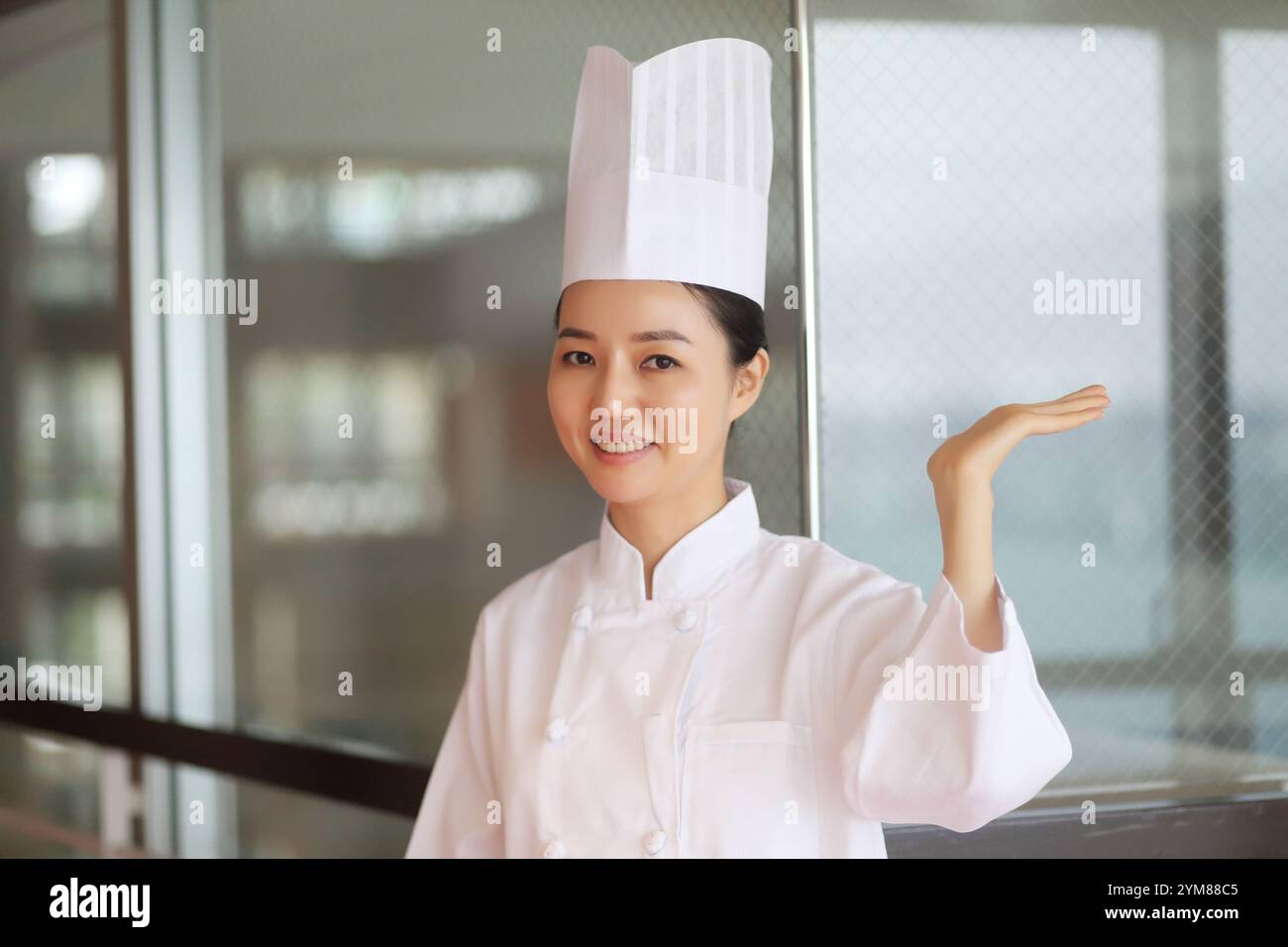 Chef sending an information sign Stock Photo - Alamy