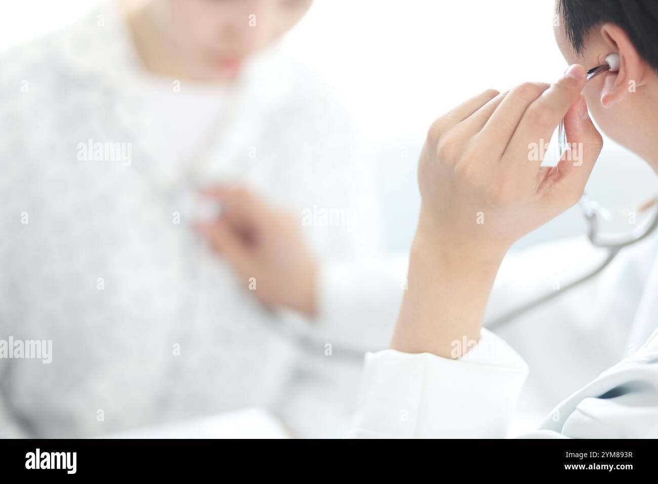 Doctor treating a patient Stock Photo - Alamy