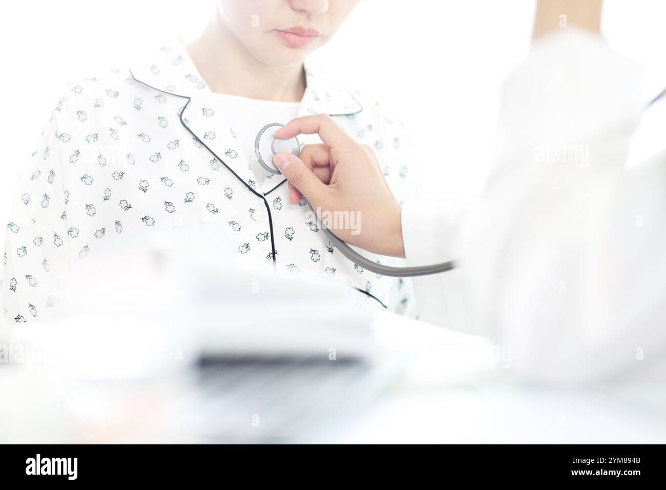 Doctor treating a patient Stock Photo - Alamy