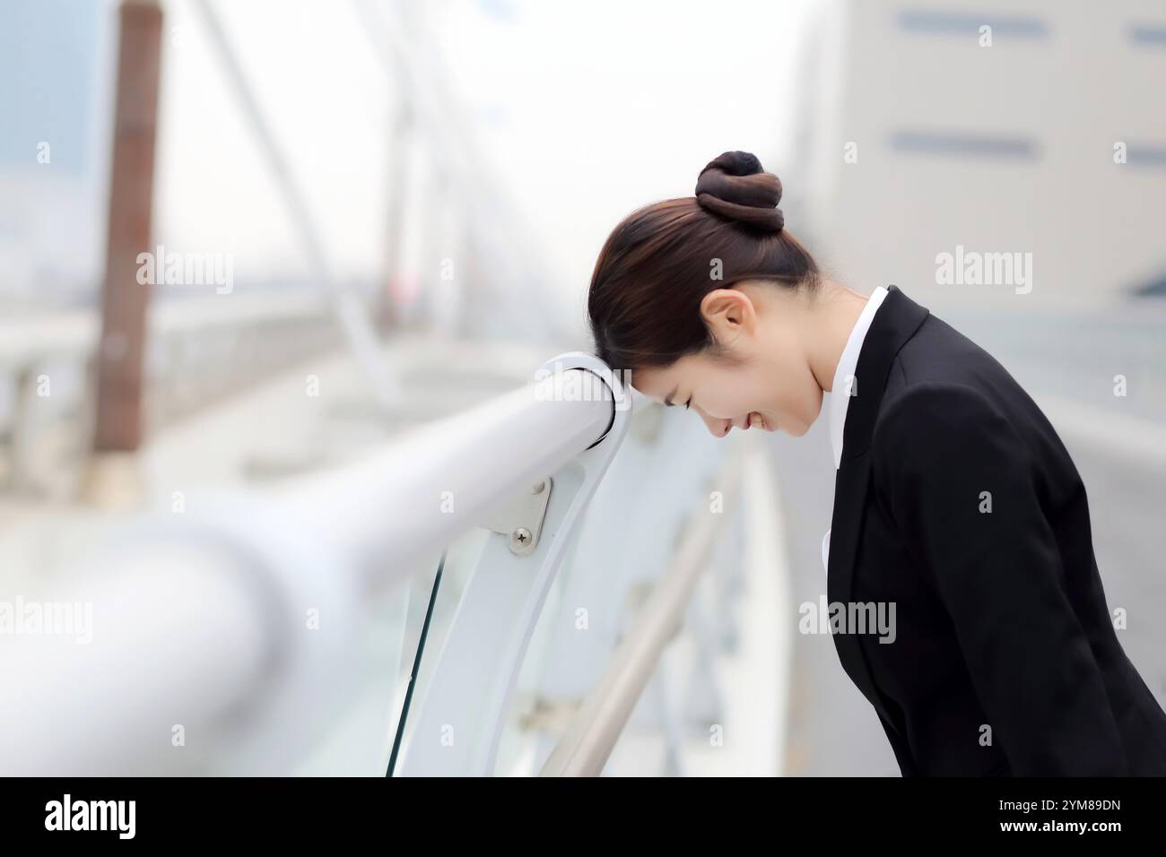 Female office worker reflecting Stock Photo - Alamy