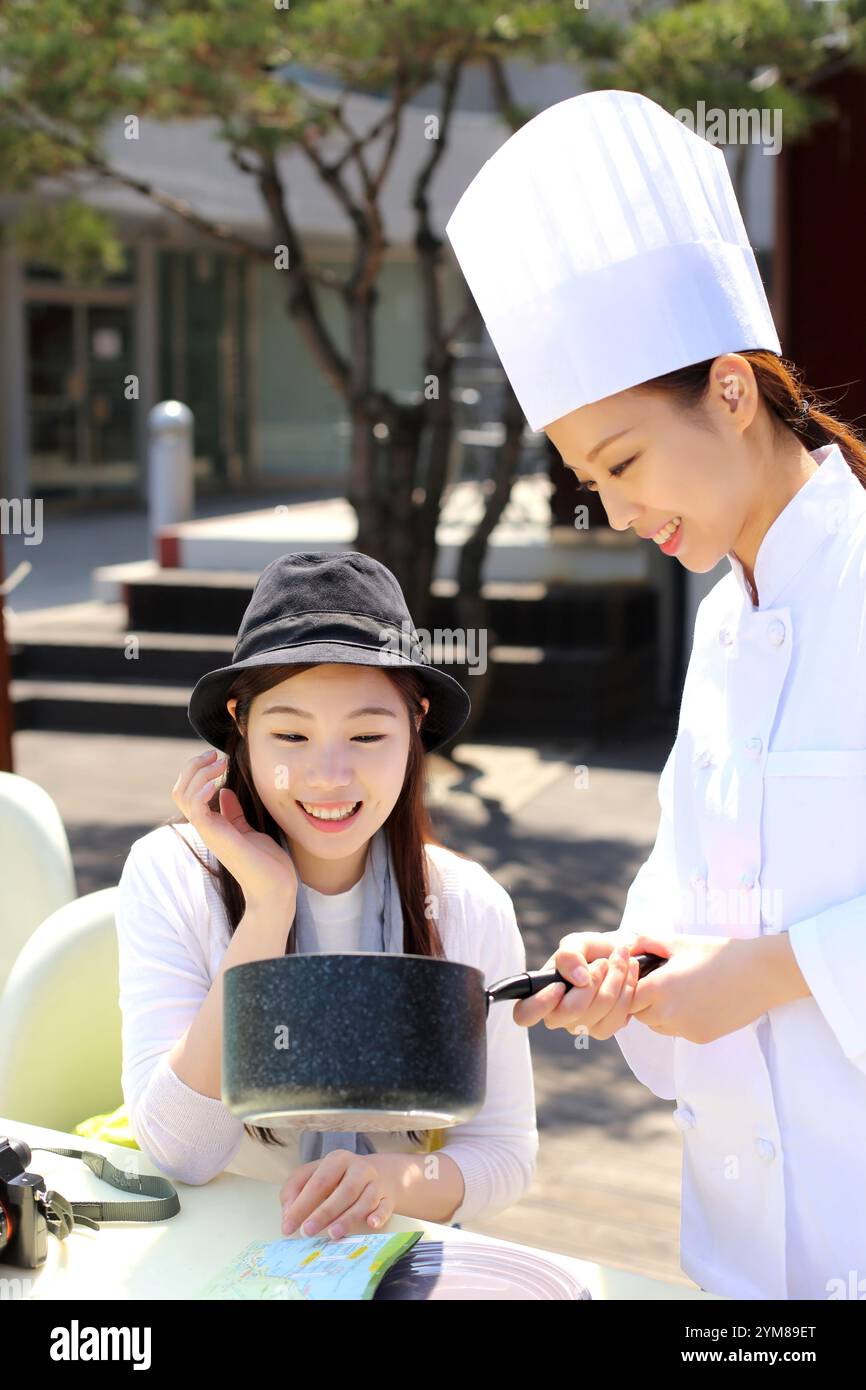 Image of a woman eating out Stock Photo - Alamy