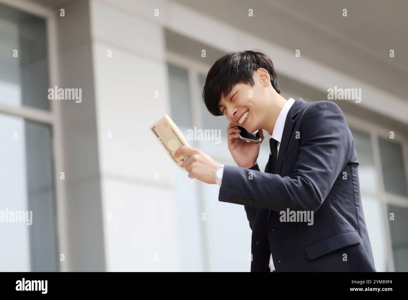 Employee enjoying receiving salary Stock Photo - Alamy