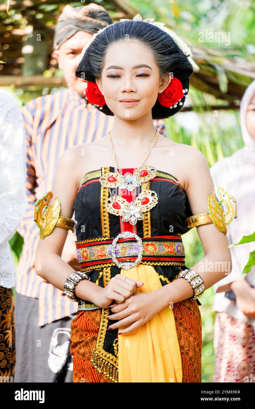 Indonesian with Javanese traditional costume Stock Photo - Alamy