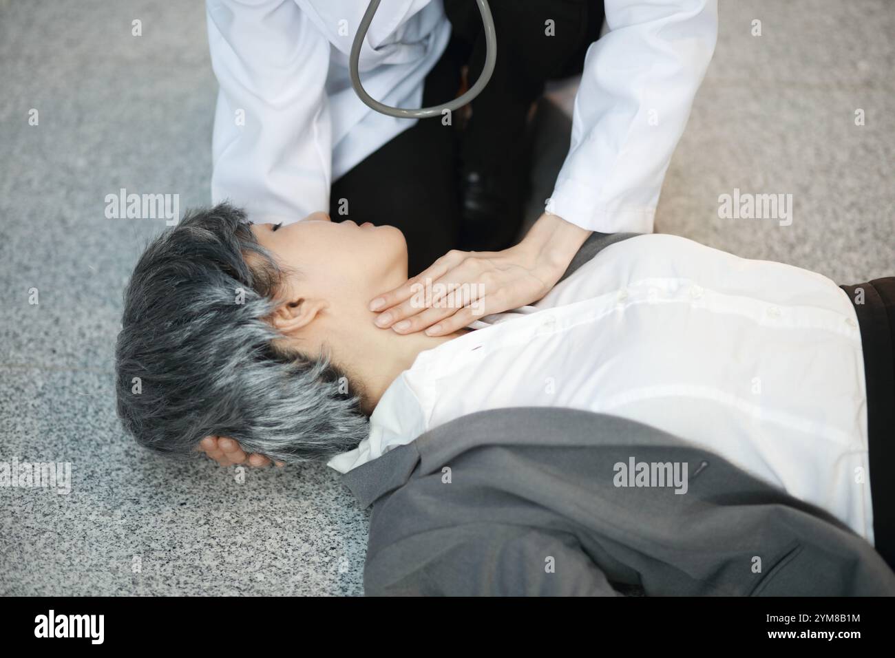 Doctor examining an emergency patient Stock Photo - Alamy