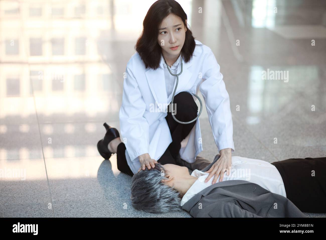 Doctor examining an emergency patient Stock Photo - Alamy